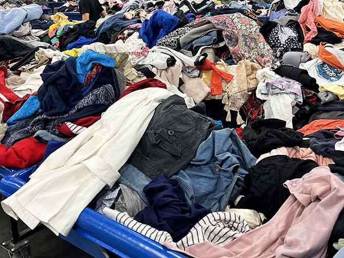 A mountain of clothing in every color imaginable, somewhere in there is exactly what your wardrobe has been missing.