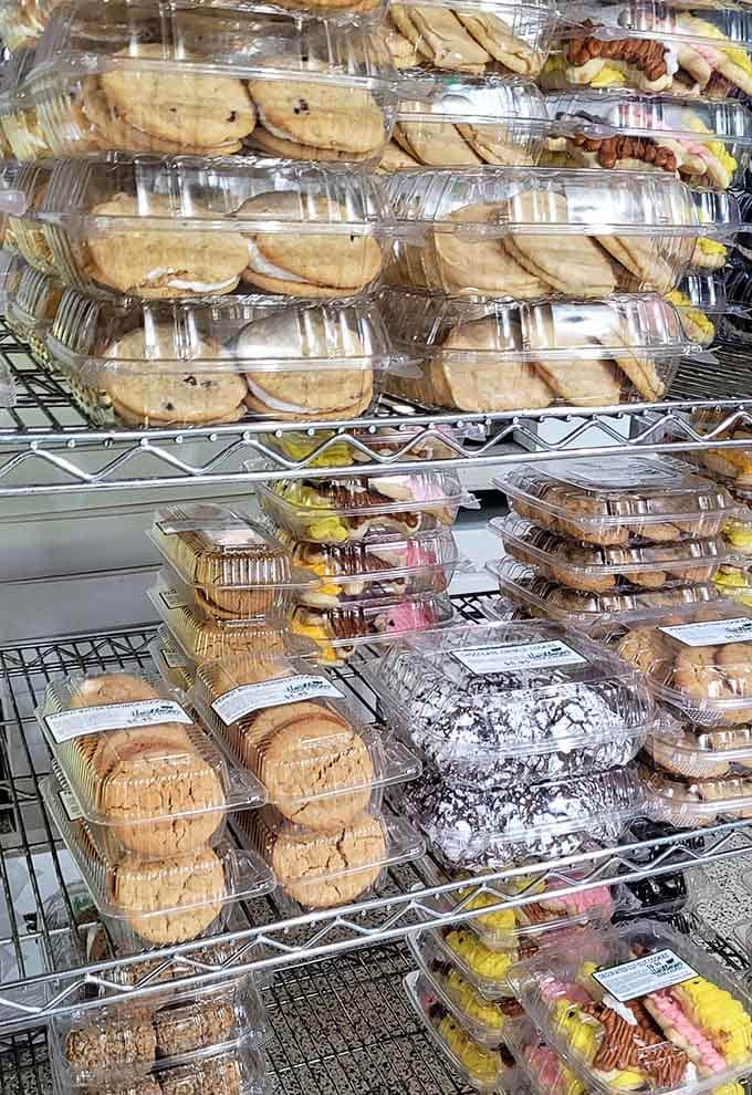 Peanut butter cookies, chocolate crinkles, sandwich cookies, and frosted cutouts stacked shelf to shelf &mdash; this is a cookie lover's fever dream.