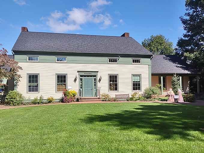 Period-dressed figures on the porch and a perfectly manicured lawn that says history never really went out of style.