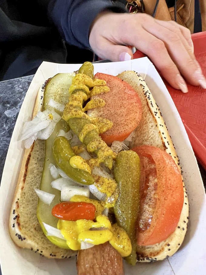 A proper Chicago-style hot dog loaded with mustard, tomatoes, pickles, and sport peppers. Homer's takes the classics seriously.