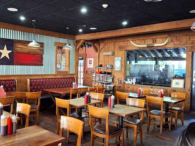 A Texas flag on the wall, longhorn horns above the kitchen window, and booths built for long, comfortable meals.