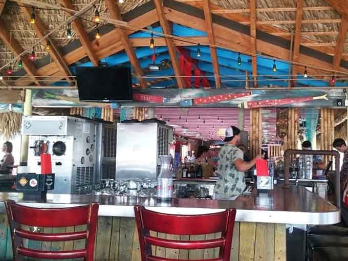 Behind that bar, frozen margarita machines hum like the happiest appliances on the entire planet.