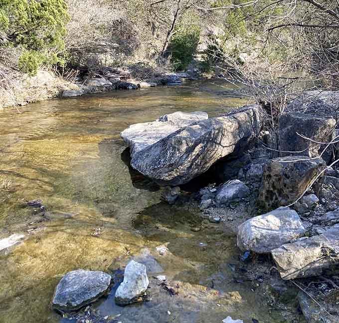 Massive limestone boulders framing the creek like nature hired its own set designer.