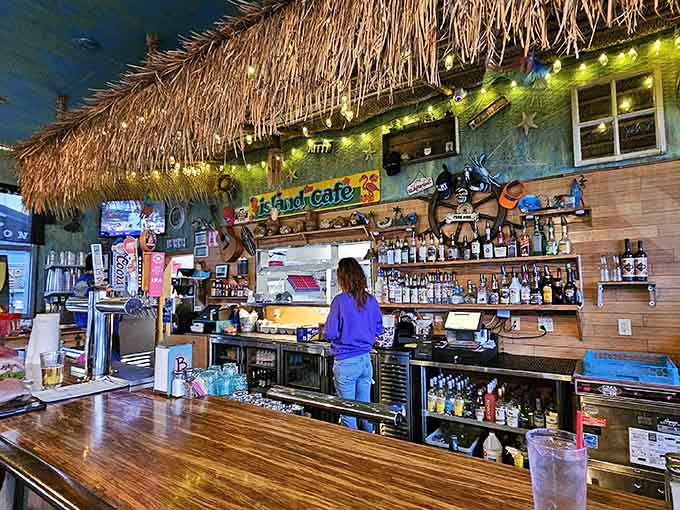 That bar, fully stocked and framed by thatched grass, is ready to make your afternoon considerably better.