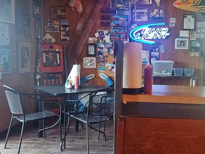 Neon signs, wooden walls, and decades of character packed into one gloriously unpretentious dining room.