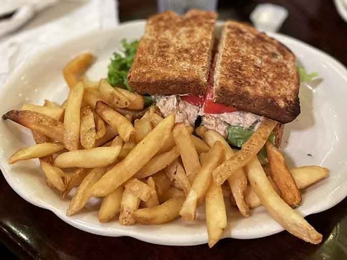 A tuna salad sandwich with a pile of golden fries. Simple, satisfying, and exactly what lunch should be.