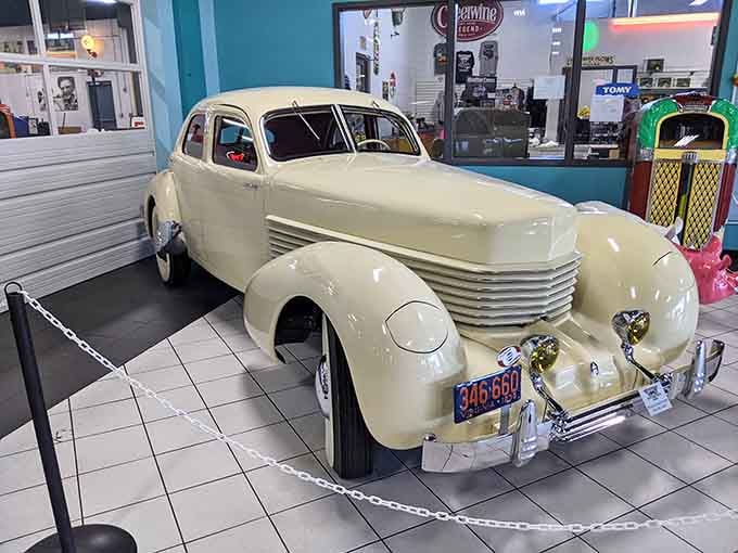 This cream-colored 1936 Cord 810 looks like it drove straight out of a Hollywood golden age film set.