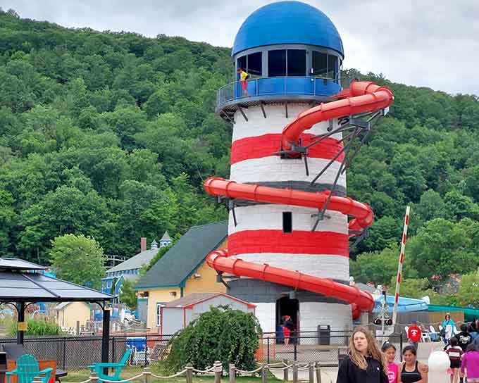 A red-and-white lighthouse with a water slide wrapped around it. Connecticut has absolutely no business being this fun.