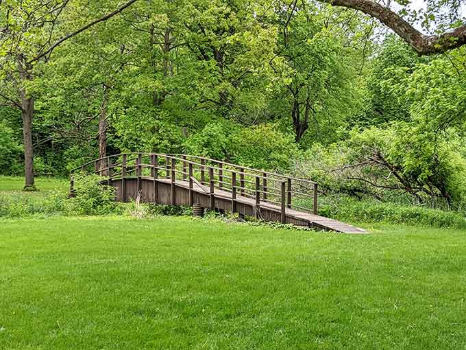 A wooden footbridge framed by fresh spring green. Cross it and feel like you've stepped into a storybook.