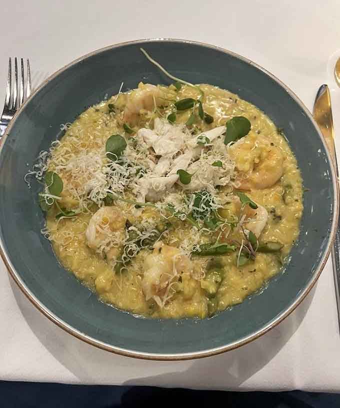 A bowl of seafood risotto so rich and golden it looks like something you'd find in a dream.