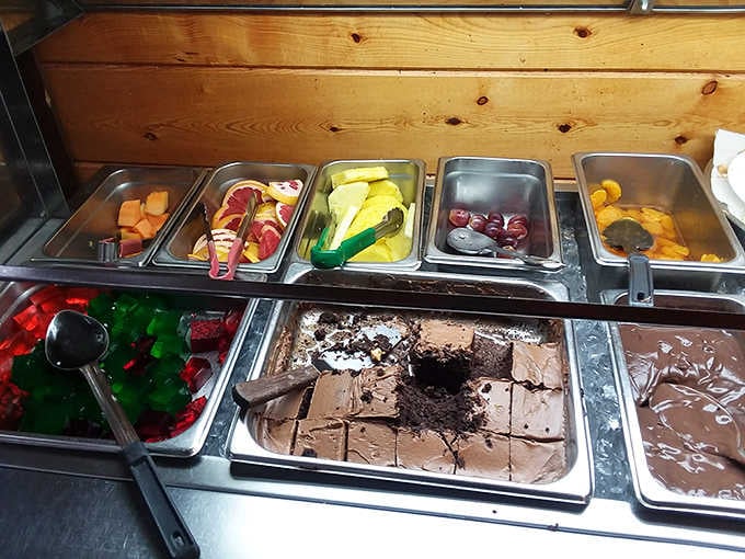 Fresh fruit, chocolate cake, and colorful Jello lined up side by side, because dessert at M & J is never an afterthought.