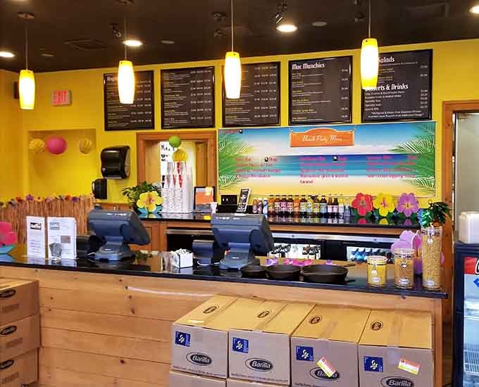 The ordering counter features a tropical beach mural, because paradise is wherever great mac and cheese happens.