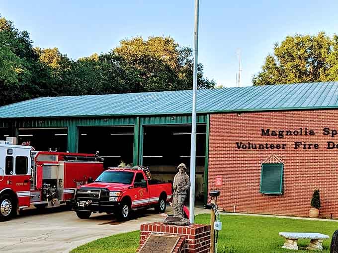 Red trucks, a brick wall, and volunteers ready to roll. Community pride looks good in Magnolia Springs.