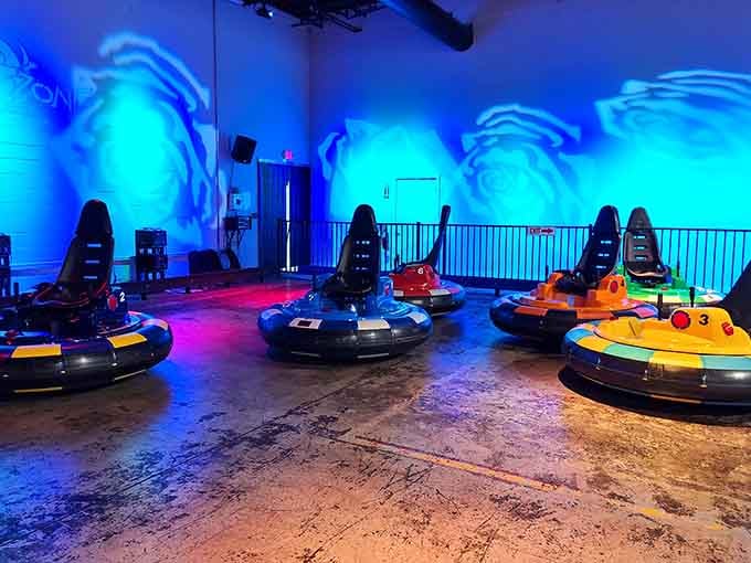 Glowing blue walls and sleek bumper cars waiting in formation look like something straight out of a sci-fi blockbuster.