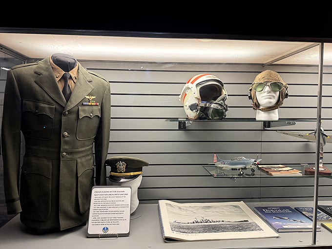 A Navy aviation uniform, flight helmets, and personal effects, each piece telling a story that deserves to be heard.