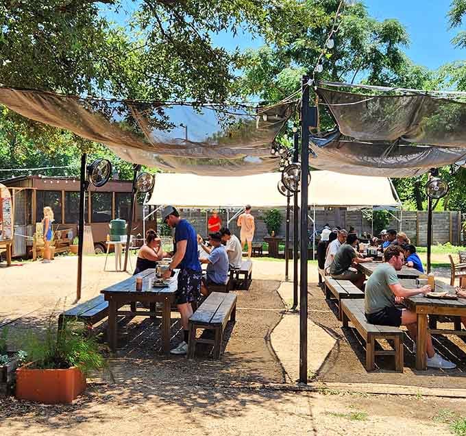 Happy diners at picnic tables prove that great barbecue brings people together in the most delicious way possible.