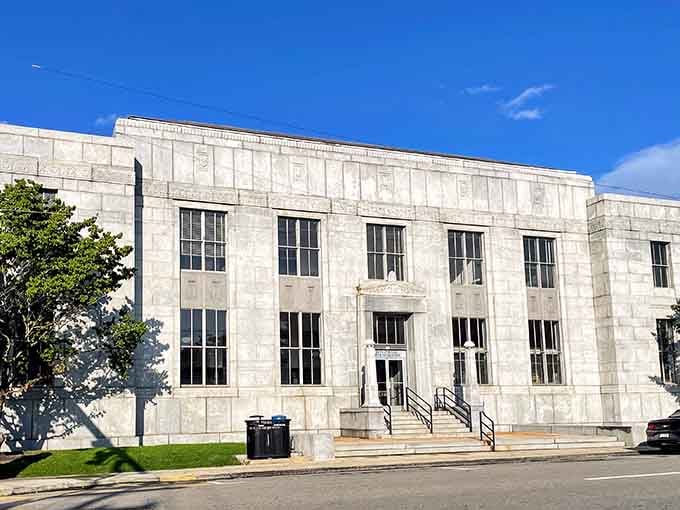 That grand marble post office building standing tall, because even the mail deserves a dignified address in this town.