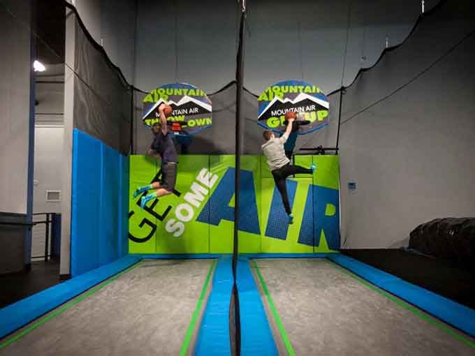 Trampoline basketball where everyone dunks like pros, finally living out those NBA dreams from your youth with springy assistance.