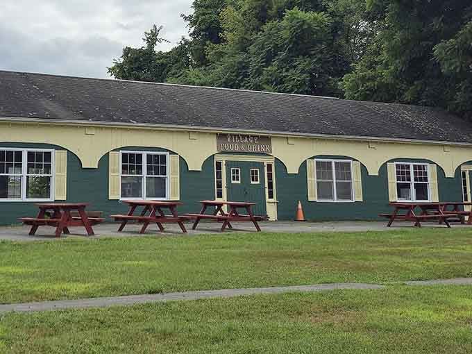 Red picnic tables, fresh air, and a sign that says Village Food and Drink. Sometimes simple is absolutely perfect.