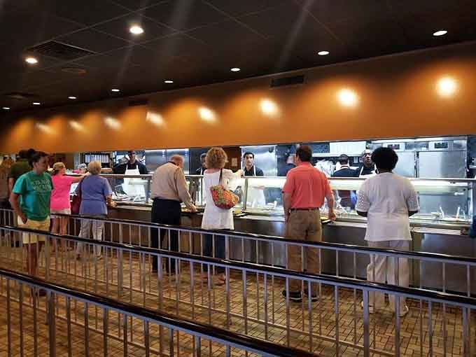 The service counter at Niki's West moves like a well-rehearsed symphony. Step up, make your choices, and hold on tight.
