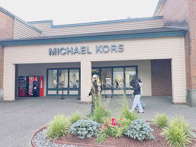 Michael Kors storefront landscaping suggests even the plants here have better style than most people's entire wardrobes combined.