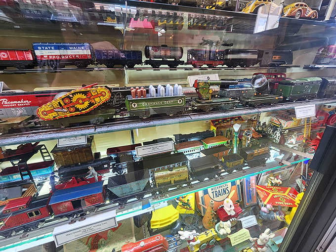 Shelf after shelf of vintage trains and collectibles, each one labeled and loved like it belongs in a proper museum, because it does.