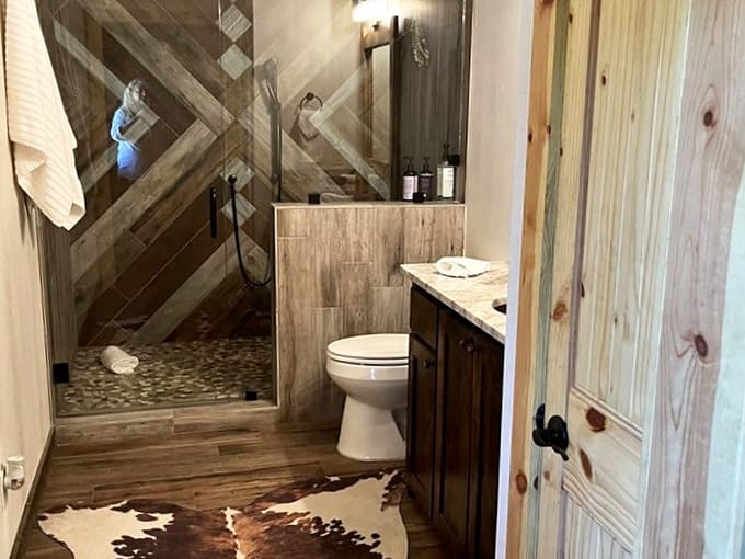 Even the bathroom maintains that rustic elegance, because attention to detail matters in every corner here.