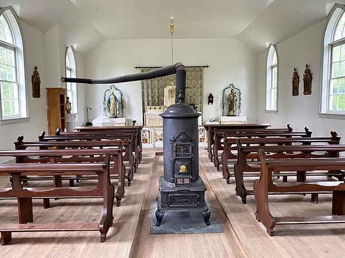 Simple wooden pews, arched windows, and a cast iron stove, this little church warmed both bodies and souls.