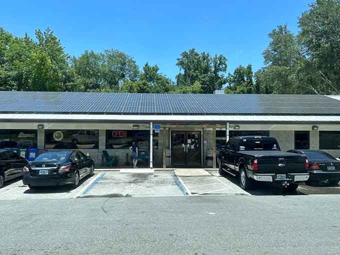 Solar panels on the roof and an open sign on the door, Pearl Country Store & Barbecue is ready for you.