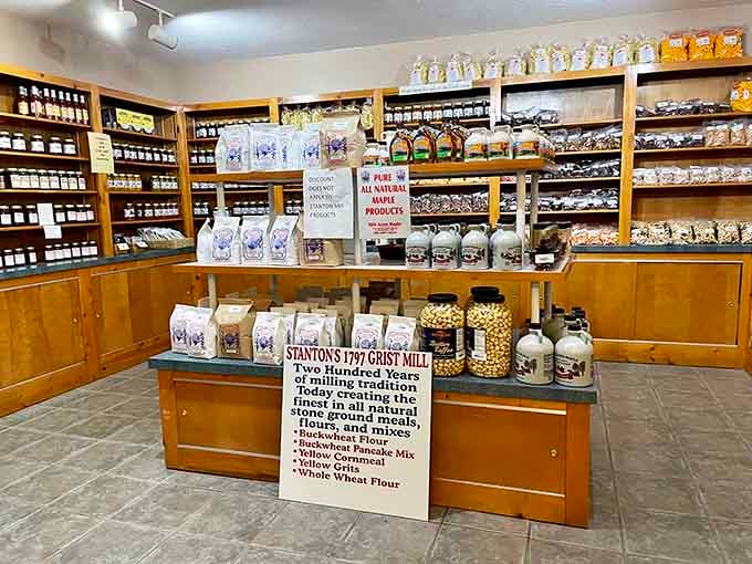 Stanton's 1797 Grist Mill products lining the shelves, buckwheat flour, cornmeal, and maple syrup that carry two centuries of milling tradition in every bag.