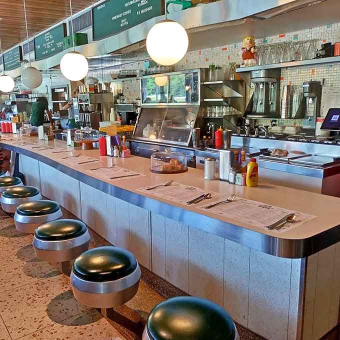Chrome stools at the counter offer front-row seats to watch culinary magic unfold before your eyes.