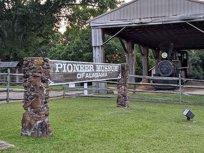 The museum's welcoming sign and vintage locomotive promise adventures in Alabama's fascinating past await inside.