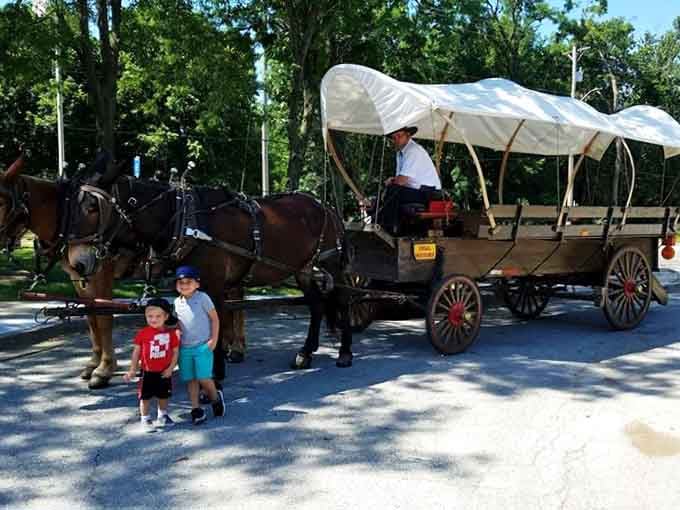 Two kids, one covered wagon, and a memory that will outlast every video game they've ever played. That's a good afternoon.