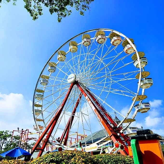 The Ferris wheel spins against a perfect blue sky, offering views that make you remember why living near New York is genuinely wonderful.