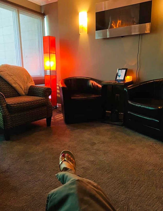 Plush chairs and warm lighting create a pre-treatment cocoon where rushing becomes physically impossible somehow.