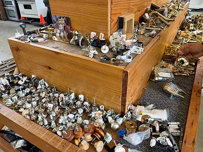 Bins overflowing with vintage door knobs and hardware, a treasure hunter's dream hiding in plain sight right on the warehouse floor.