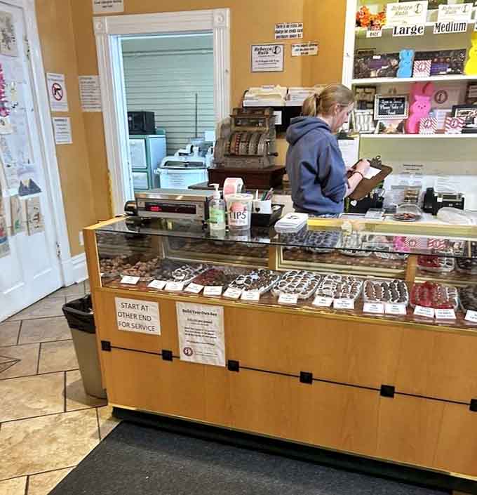 A glass display case full of handcrafted chocolates, where every single piece deserves your undivided attention.
