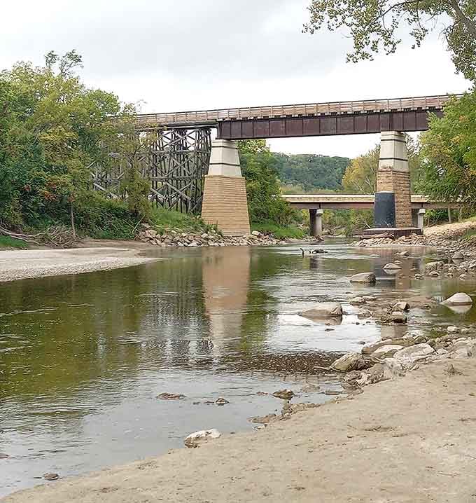 From river level, the bridge's impressive stone piers reveal the craftsmanship that's kept this structure standing strong since the 1900s.