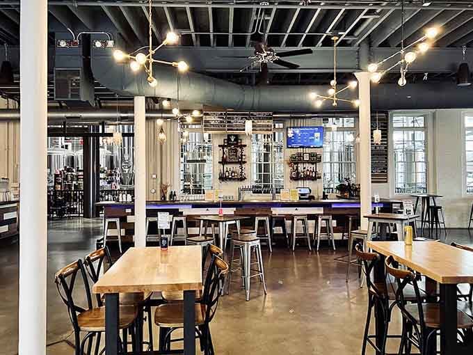 A bar that stretches out with promise, backed by shelves of glassware ready for your next pour.