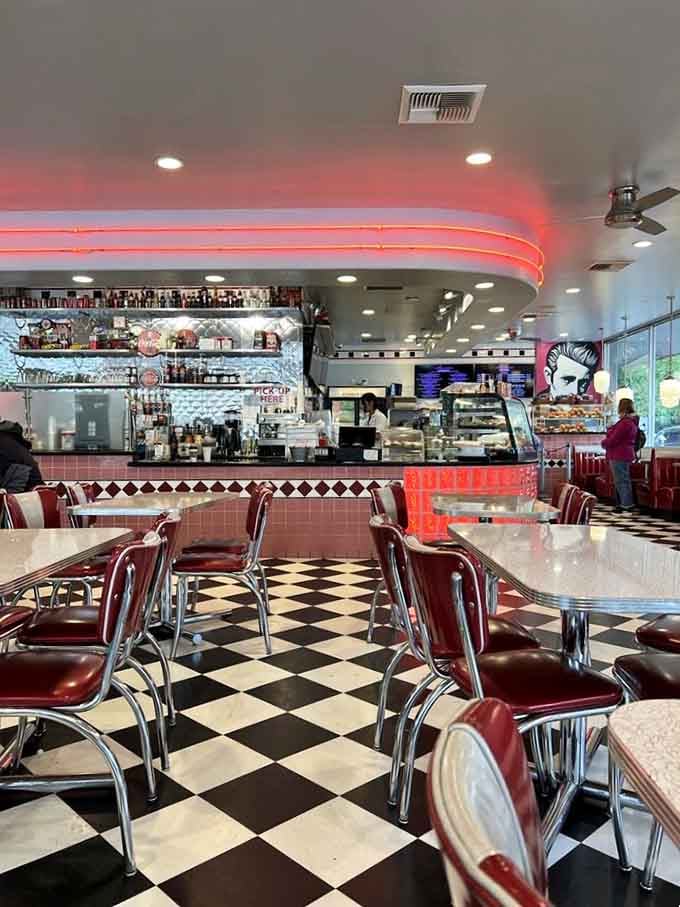The service counter hums with quiet purpose, framed by neon and chrome, where all the magic gets handed over.