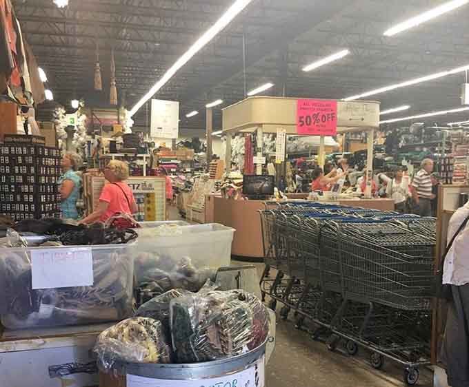 Happy shoppers navigating the bustling aisles, proof that the love of fabric brings people together beautifully.