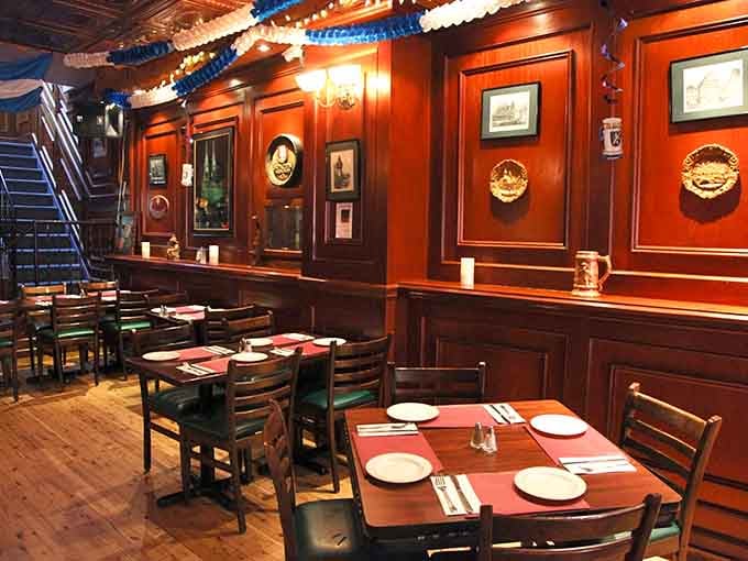 Rich wood paneling, warm lighting, and decorative plates on the walls. This room has genuine personality and soul.