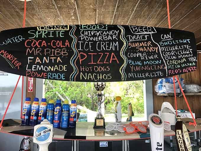 The snack stand menu offers pizza, ice cream, and cold drinks to refuel between rounds of aquatic acrobatics.
