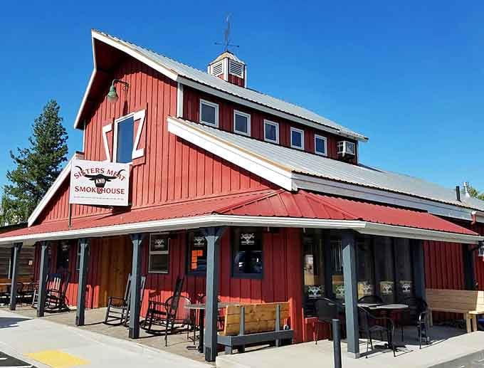 Sisters Meat and Smokehouse sits in a barn-red building that smells like everything your weekend was missing until right now.