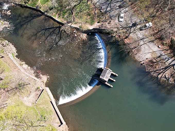 From above, the curved spillway looks like something an architect dreamed up after a very good day.