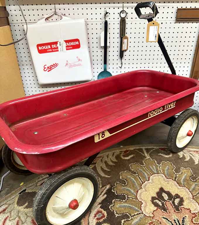A classic Radio Flyer wagon, red and road-worn, carrying decades of backyard memories and still looking absolutely iconic.