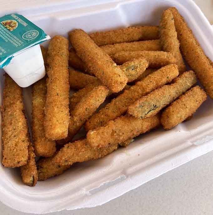A whole basket of crunchy zucchini fries with ranch dipping sauce is the side dish that quietly steals the show.