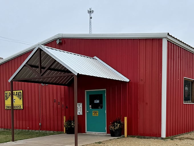 Blackland Smokehouse's bold red exterior is basically a billboard that says, "Serious barbecue happens inside these walls."