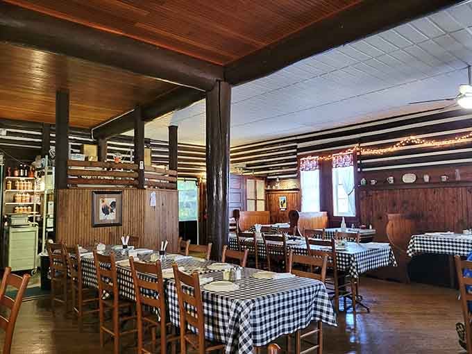 Long tables, wooden chairs, and warm log walls. This dining room has hosted a thousand good conversations and counting.