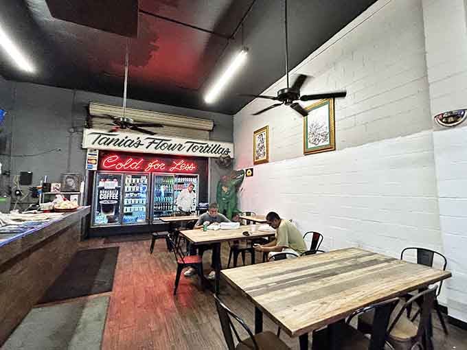 Regulars settling in under ceiling fans, cold drinks nearby, nobody in a hurry. This is the life.